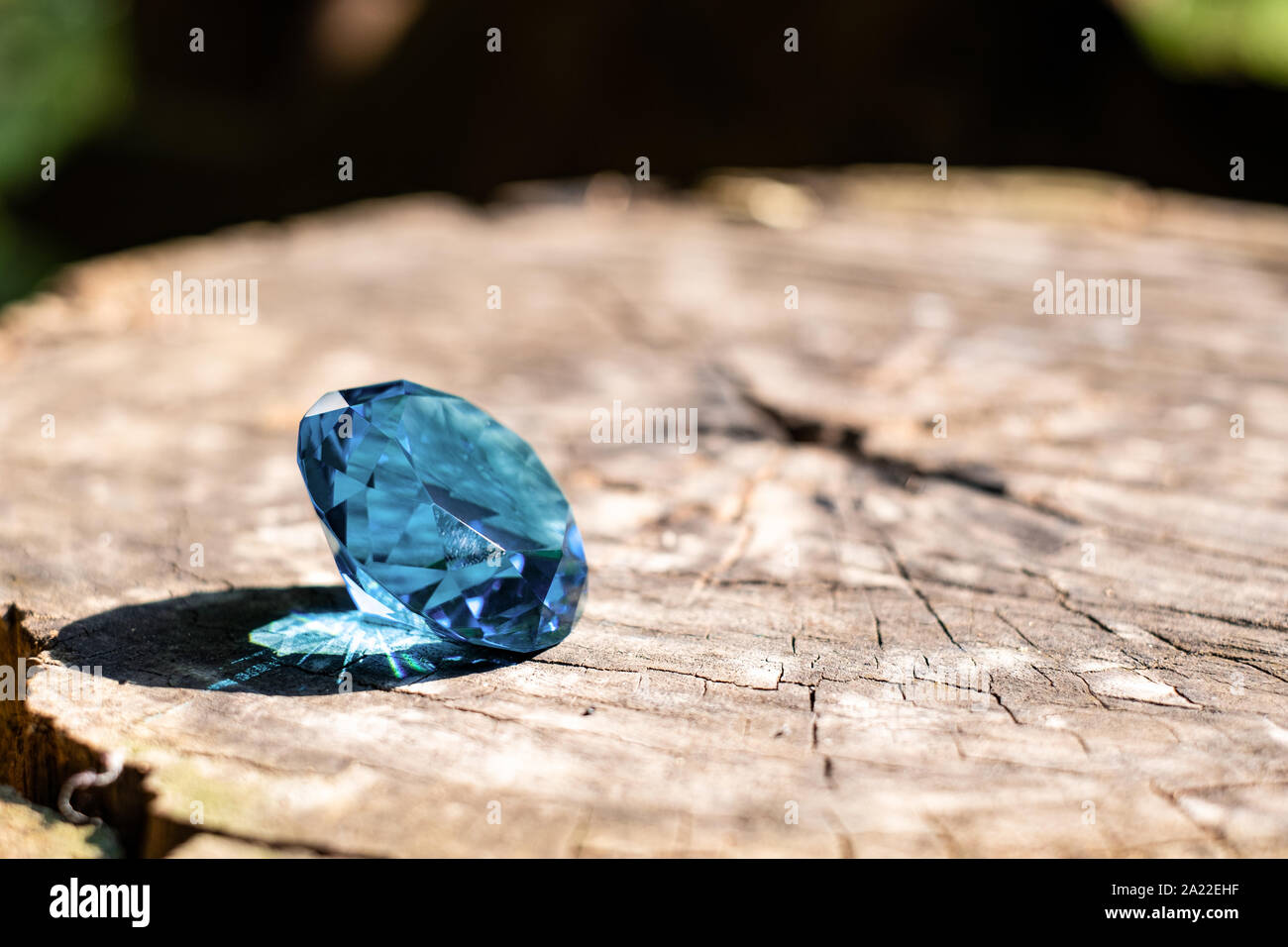 Round blue diamond at wood background Stock Photo - Alamy
