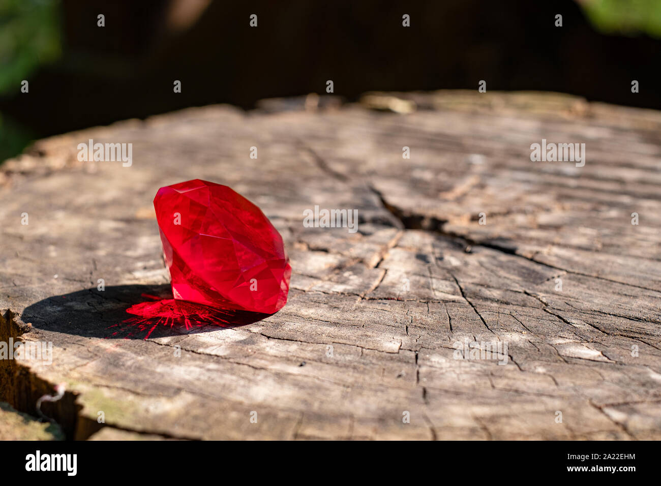 Round red diamond at wood background Stock Photo - Alamy