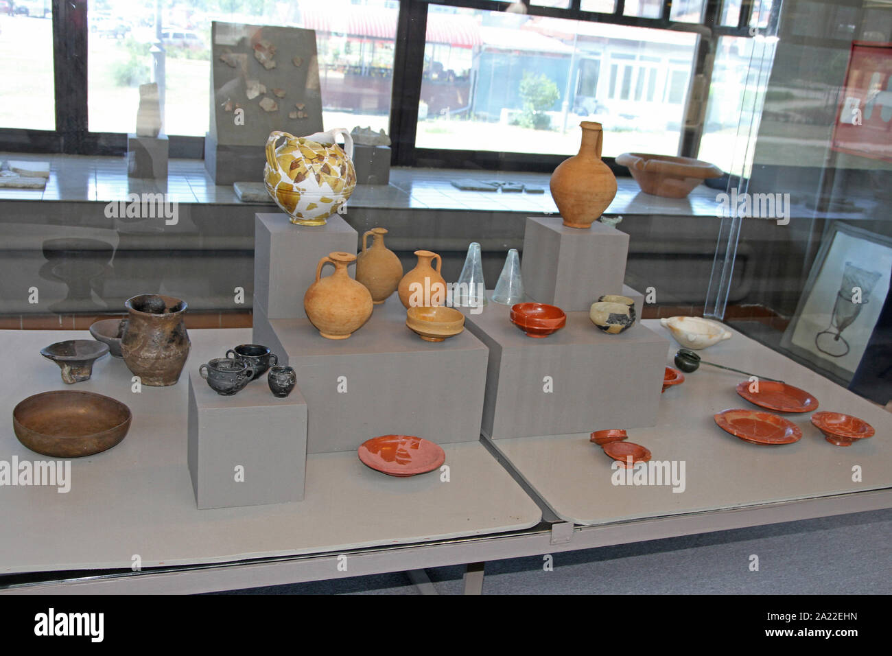 Collection of clay jugs, pots, plates, bowls drinking cups and other ...