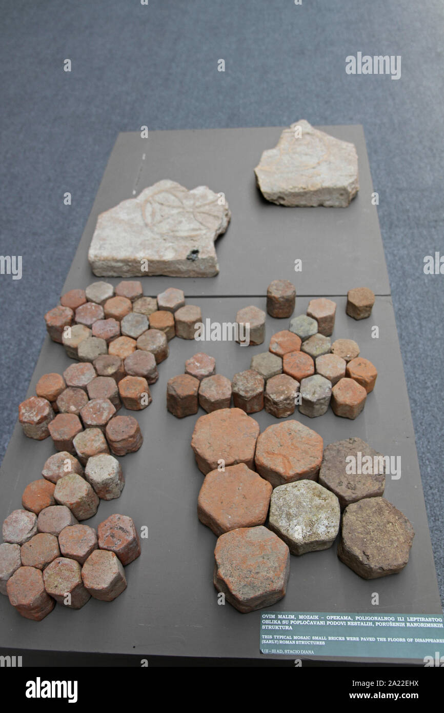 Collection of ancient fragments and ancient hexagonial brick tiles ...
