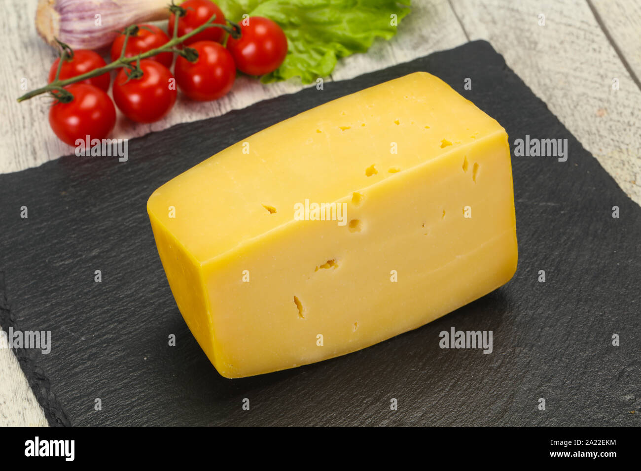 Swiss Hard yellow tasty cheese brick Stock Photo - Alamy