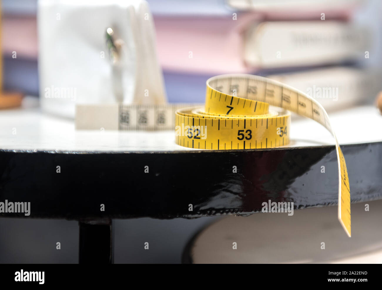 Close-up of small side table with Yellow Measuring Tape, Shirt Cloth ...