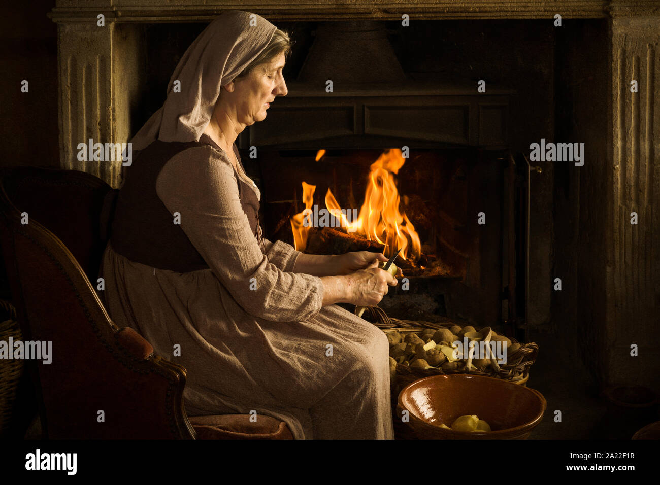 Renaissance old master portrait of a peasant woman peeling potatoes at ...