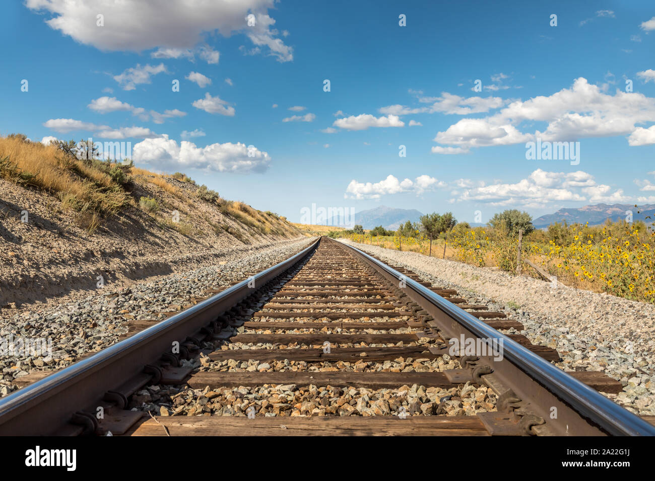 Straight railraod track in the scenic landscape of Utah Stock Photo - Alamy
