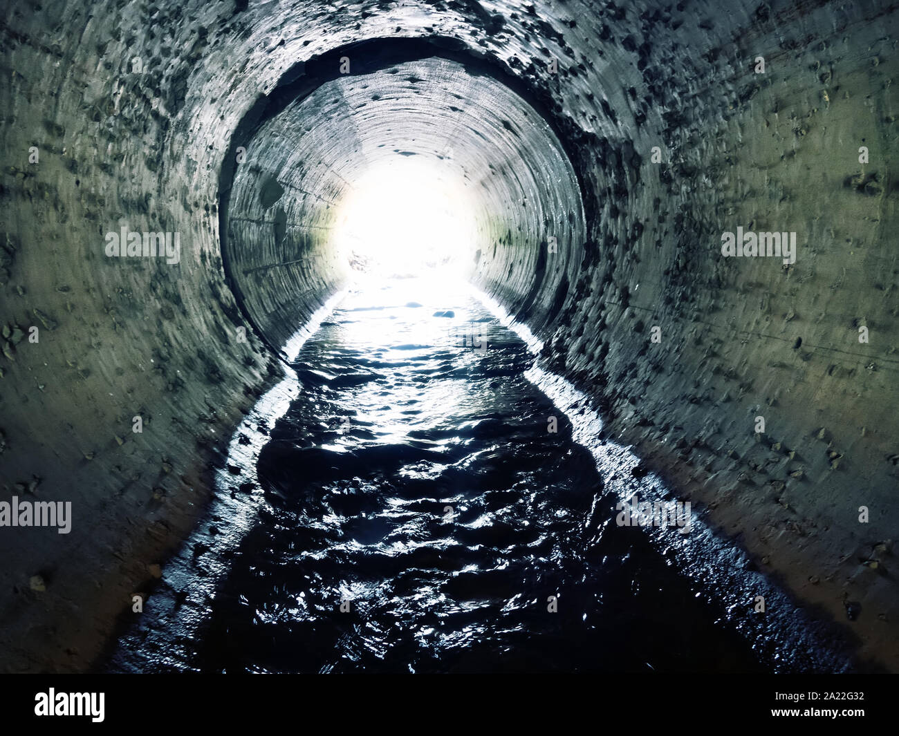 Drainage pipe under the highway (culvert). Filming inside the pipe ...