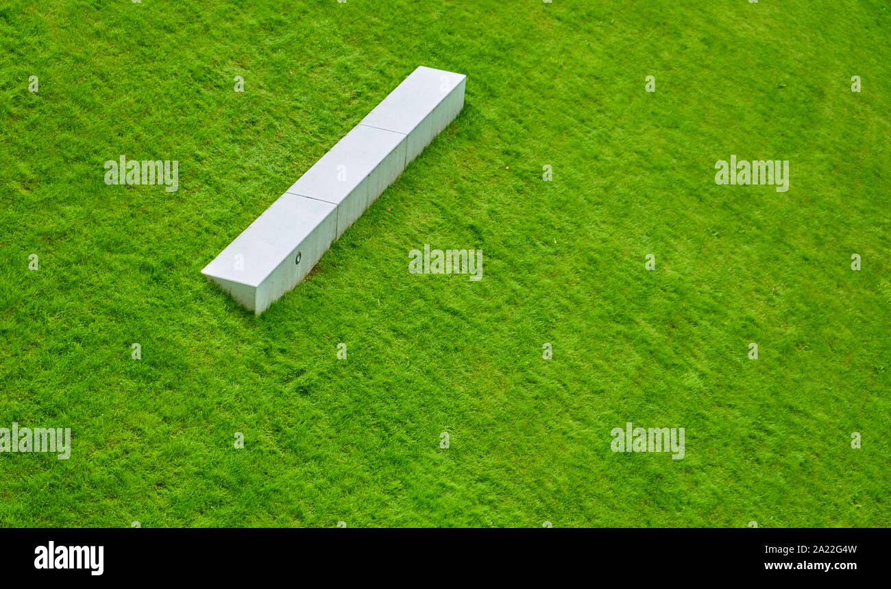 Abstract image of an inclined grass surface on an embankment with a ...