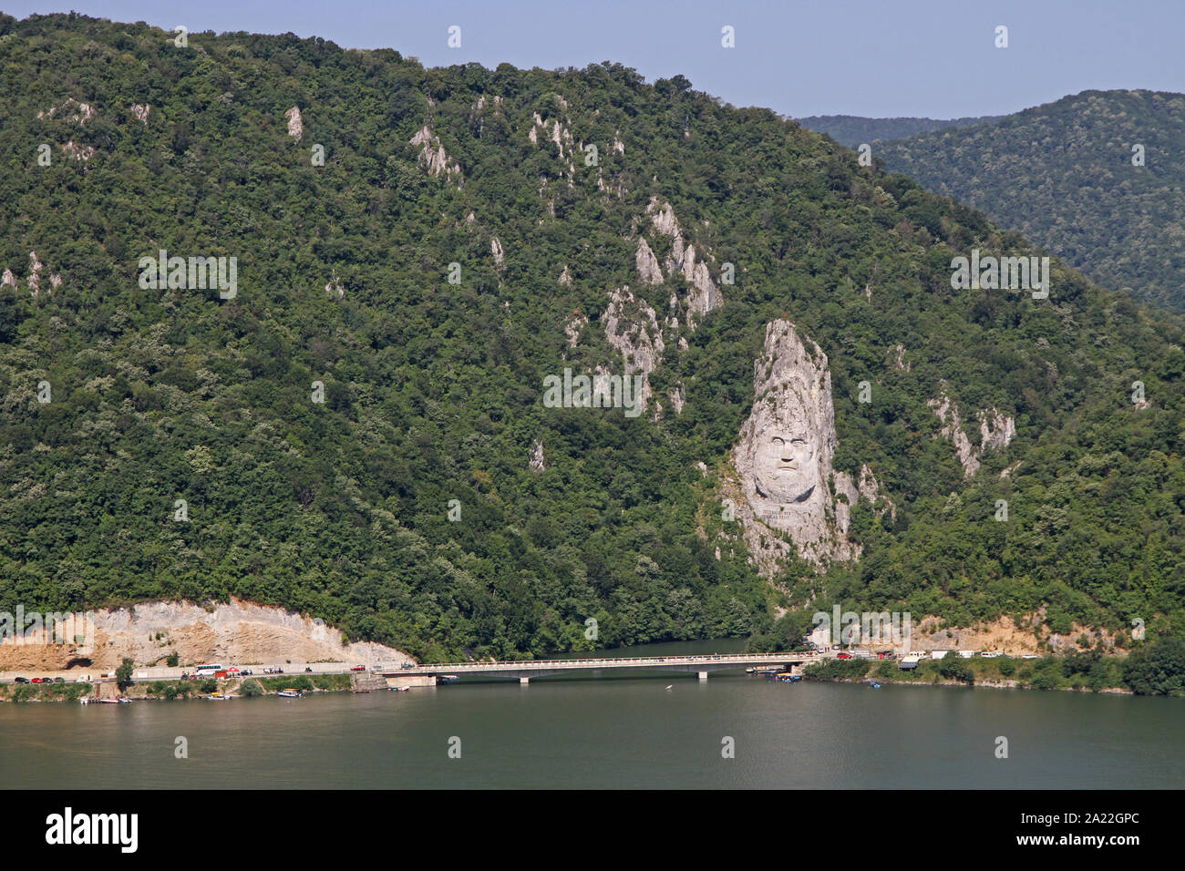 The rock relief outcrop sculpture of the face of Decebalus and a Route ...