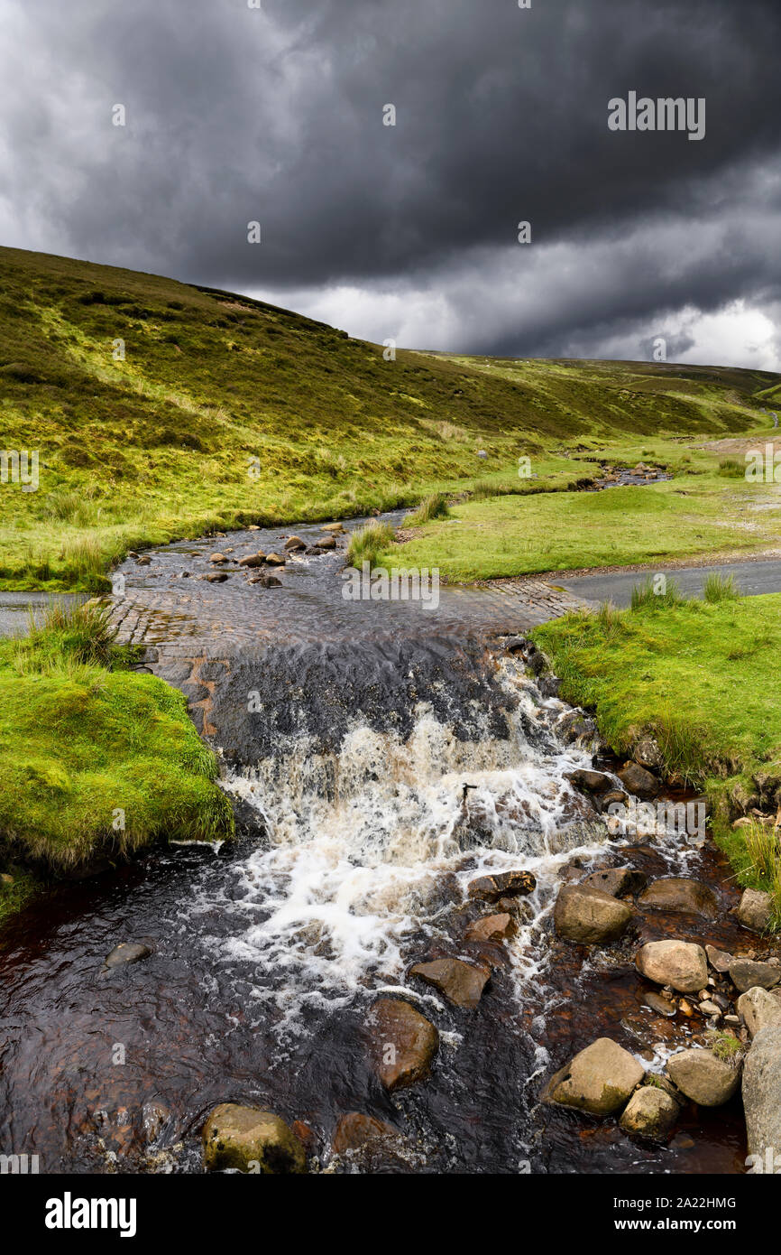 Dark clouds over Ford at Fore Gill Gate on the Bleaberry Gill stream ...