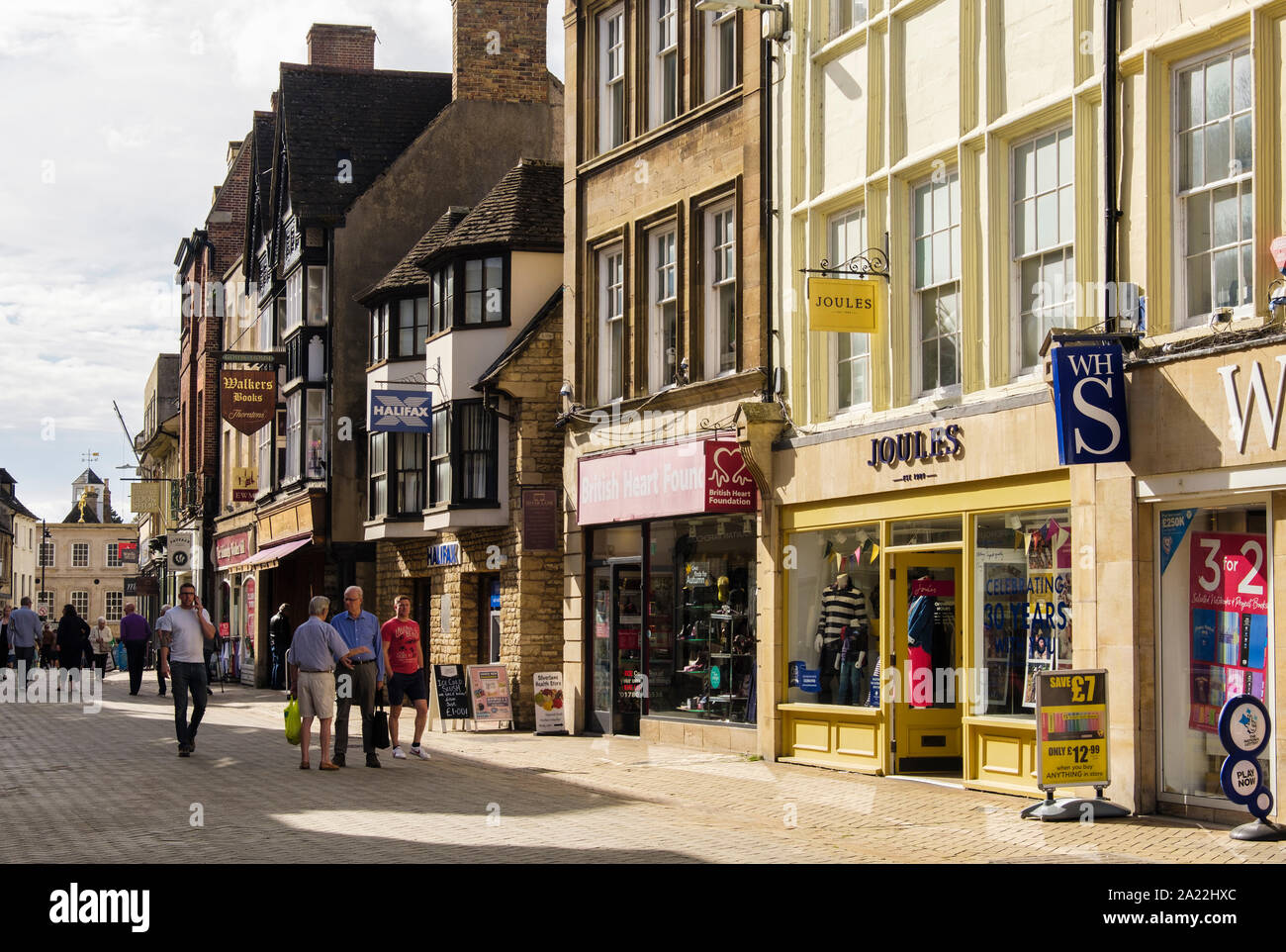 Shops in old buildings on pedestrianised shopping street in historic ...
