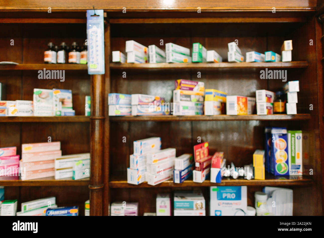Pharmacy blurred light tone with store drugs shelve interior background ...