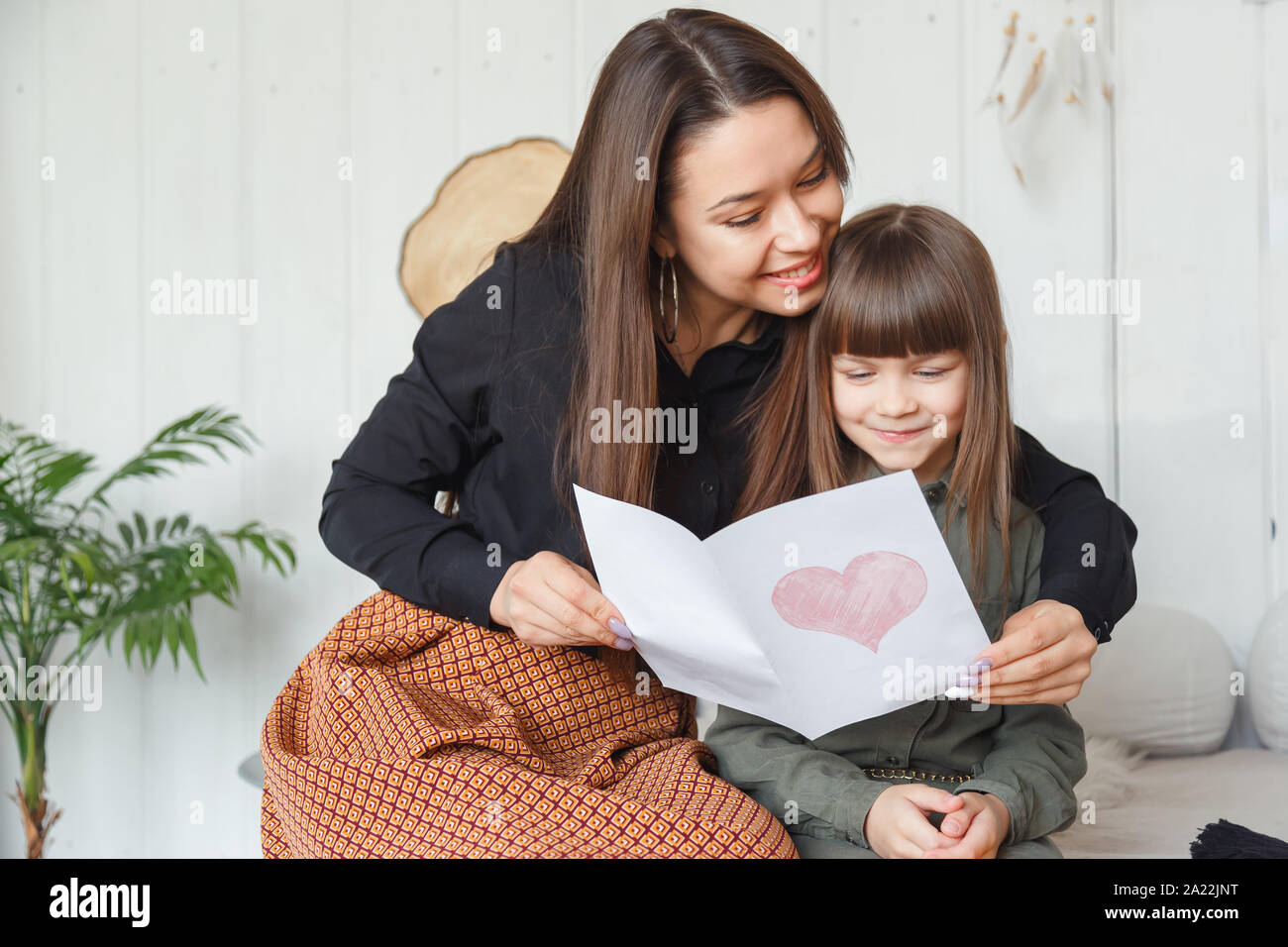 Daughter congrats mom on mother's day Stock Photo - Alamy