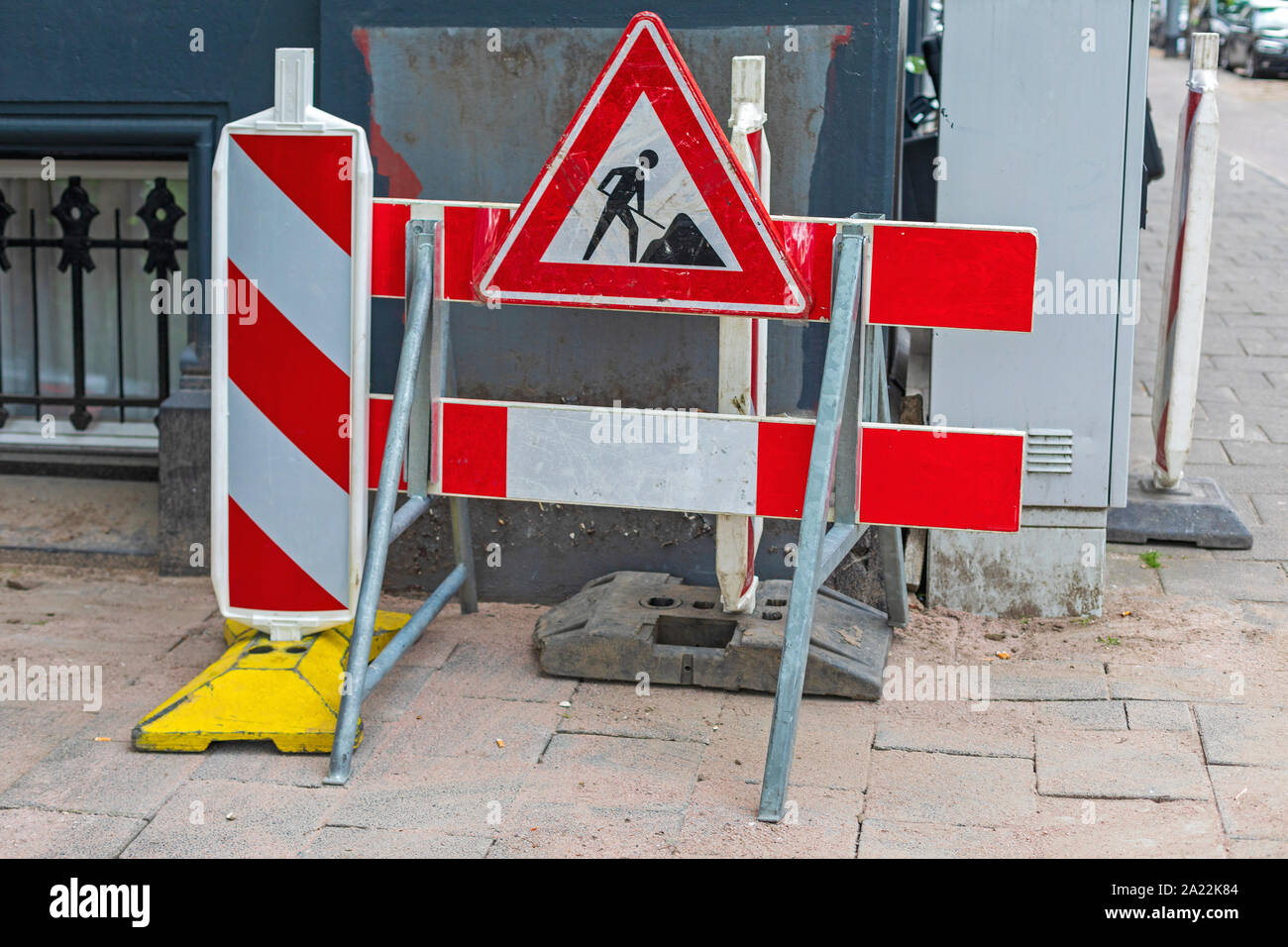 Road Works Sign at Construction Barrier at Street Stock Photo - Alamy