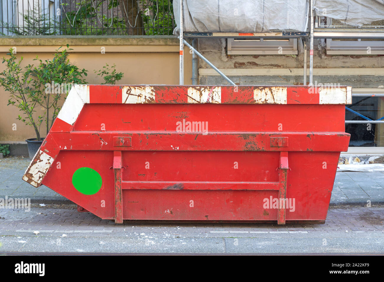 Big red skip container at construction site in city hi-res stock ...