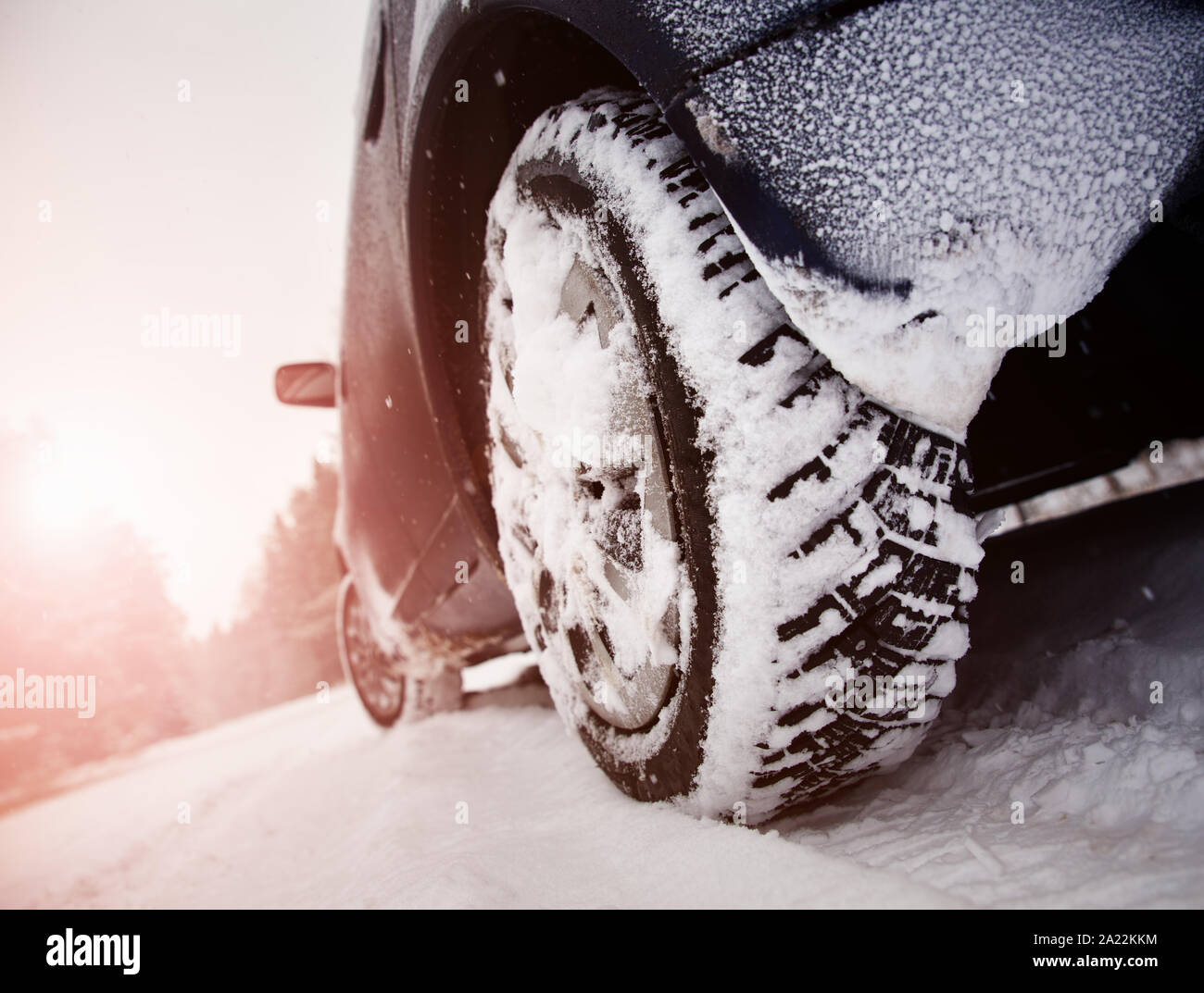 Car tires on winter road covered with snow Stock Photo - Alamy