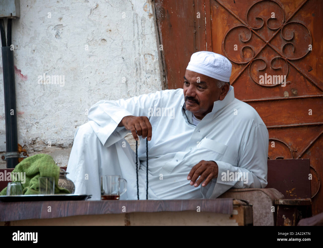 Man praying in Jeddah, Saudi Arabia with his prayer beads Stock Photo ...