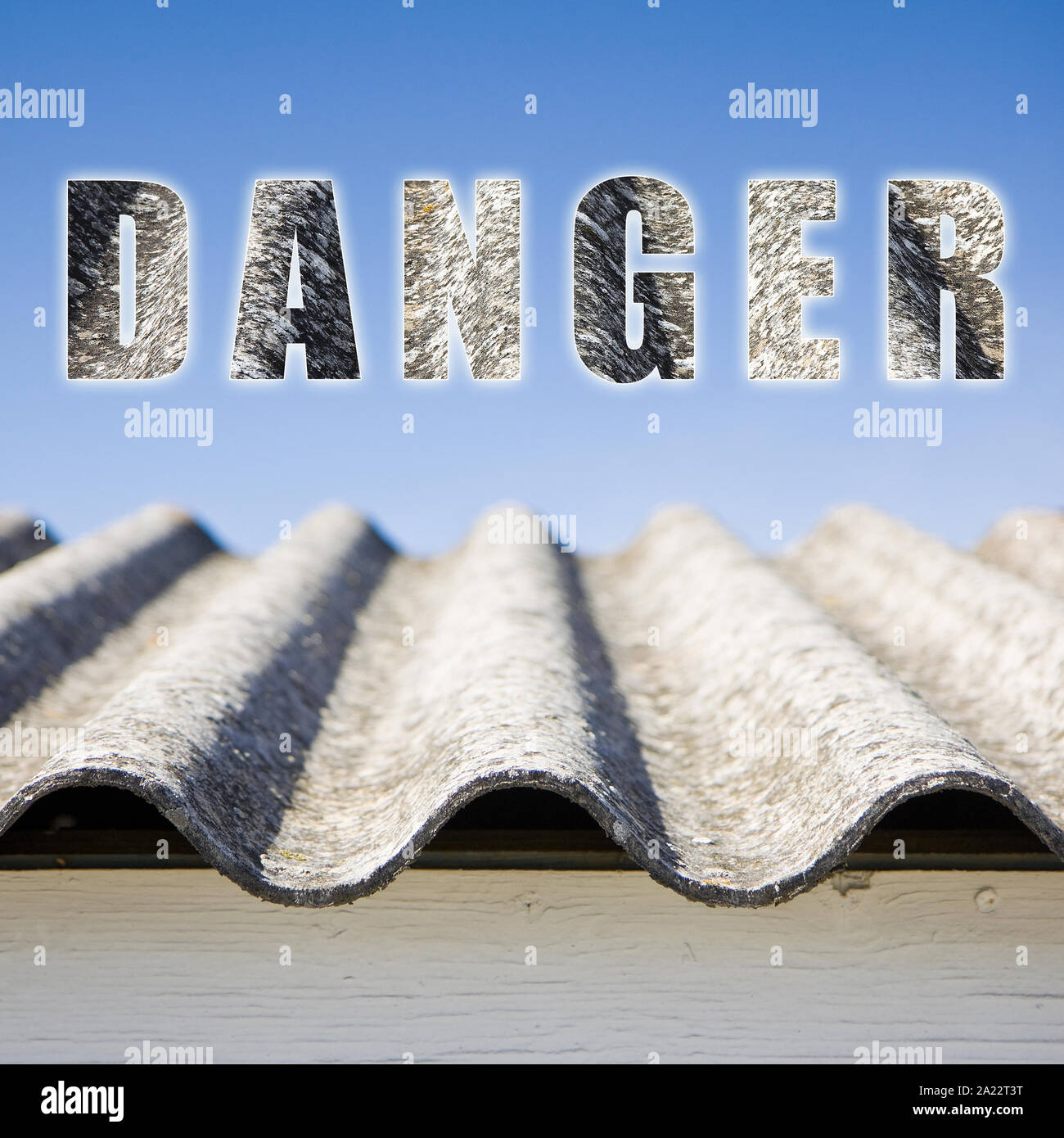 The word "danger" written with letters having asbestos graphics ...