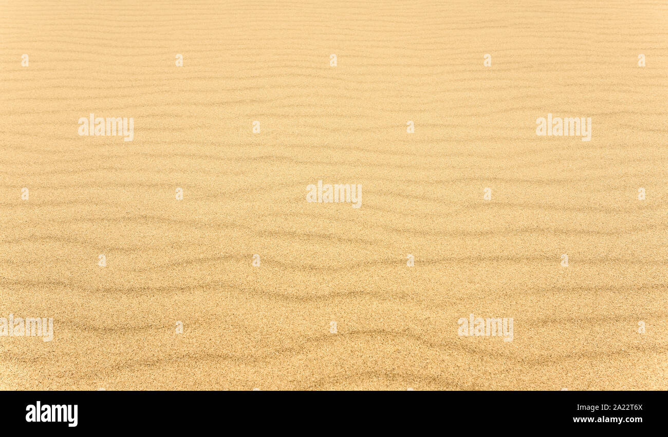 Yellow sand texture for background Stock Photo - Alamy