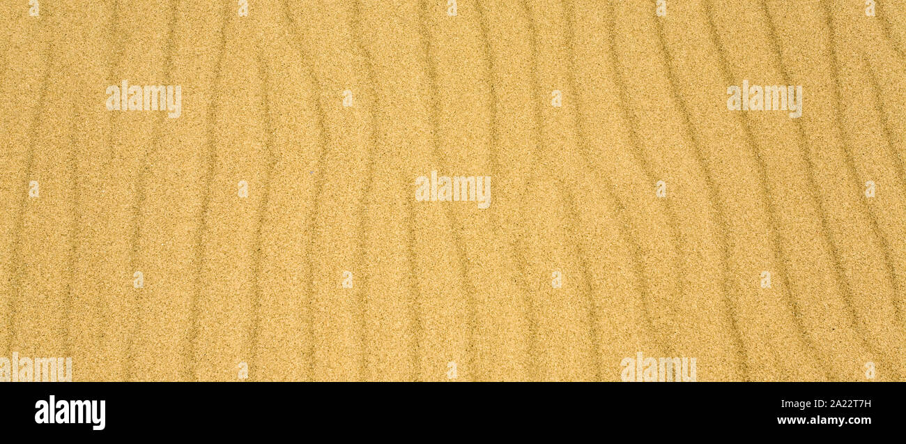 Yellow sand texture for background Stock Photo - Alamy
