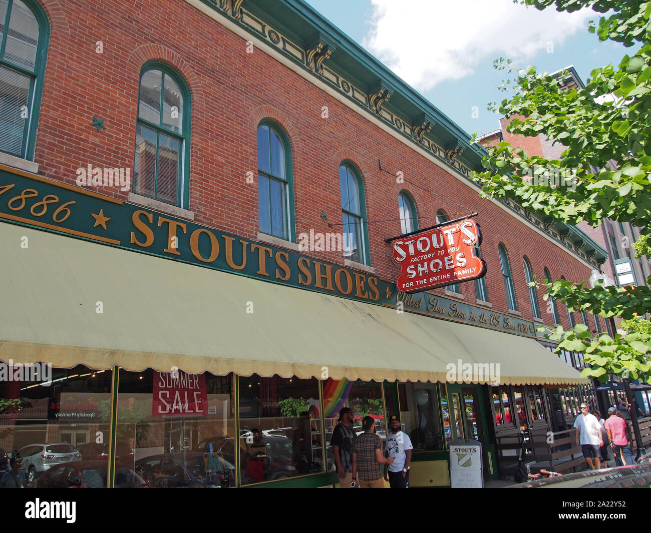 People strolling past the famous Stout's Shoe Store located along Mass ...