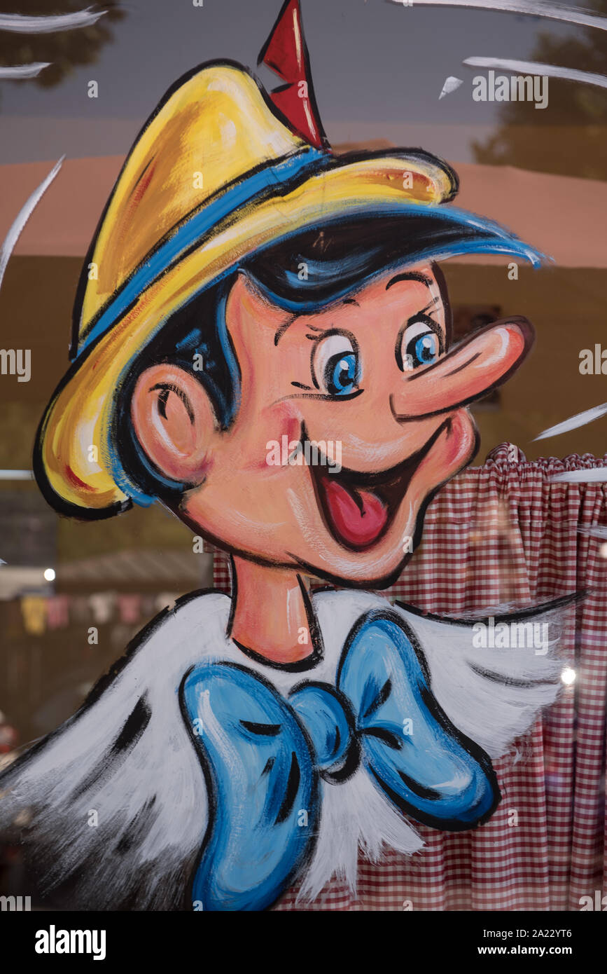 Pinocchio Disney Style in a showcase of a local pizzeria Stock Photo ...