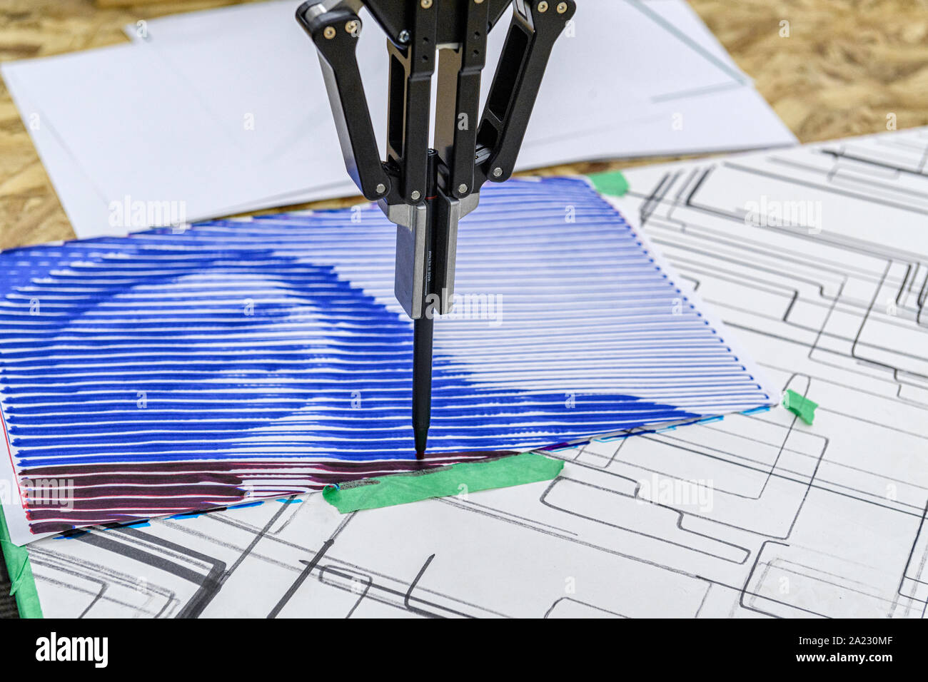 Robotic arm creating a portrait on paper from a digital file Stock ...