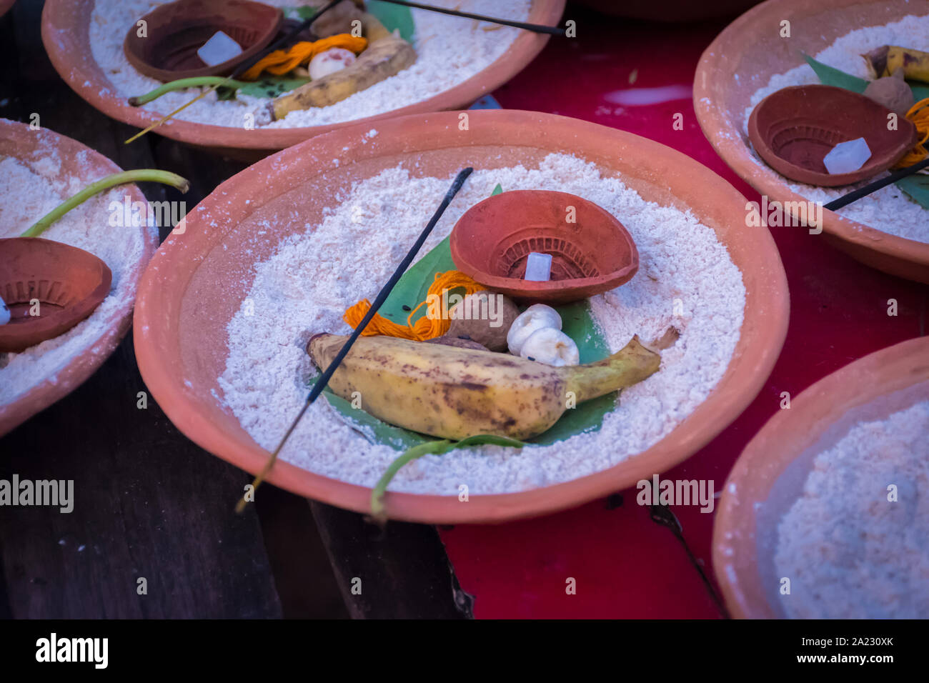 Soil malasa with rudraksha mala, Supari or betel nut, banana, pan pata ...