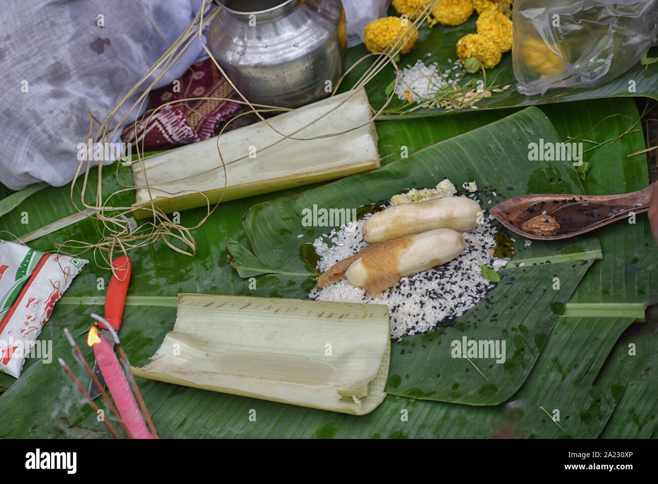 Soil malasa with rudraksha mala, Supari or betel nut, banana, pan pata ...