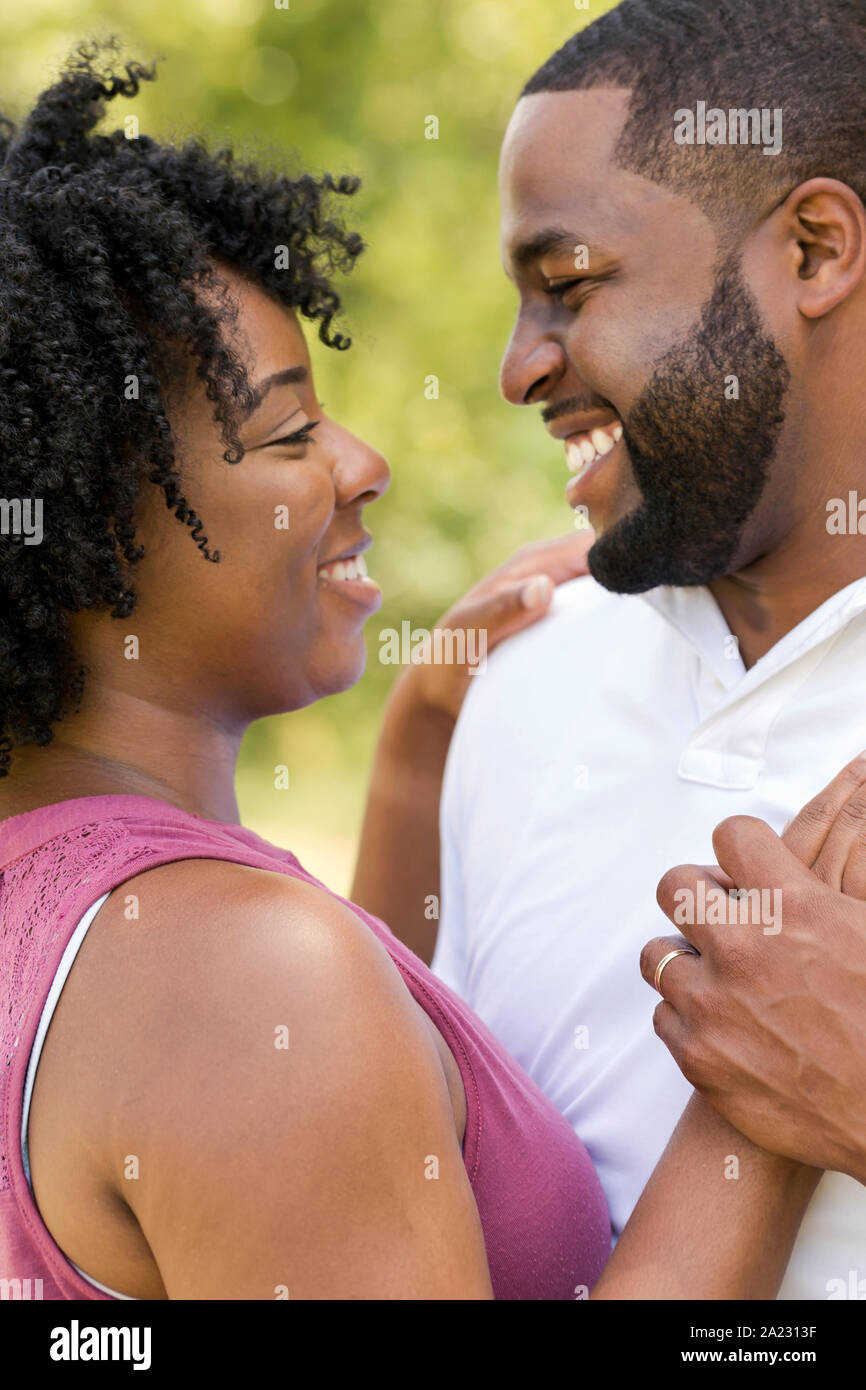 Happy black couple laughing park hi-res stock photography and images ...