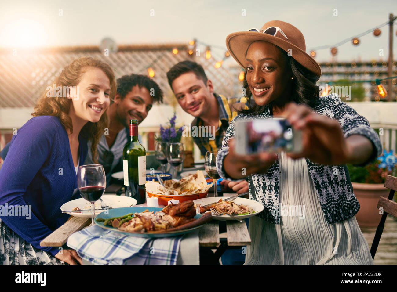 African friends enjoying dinner party hi-res stock photography and ...