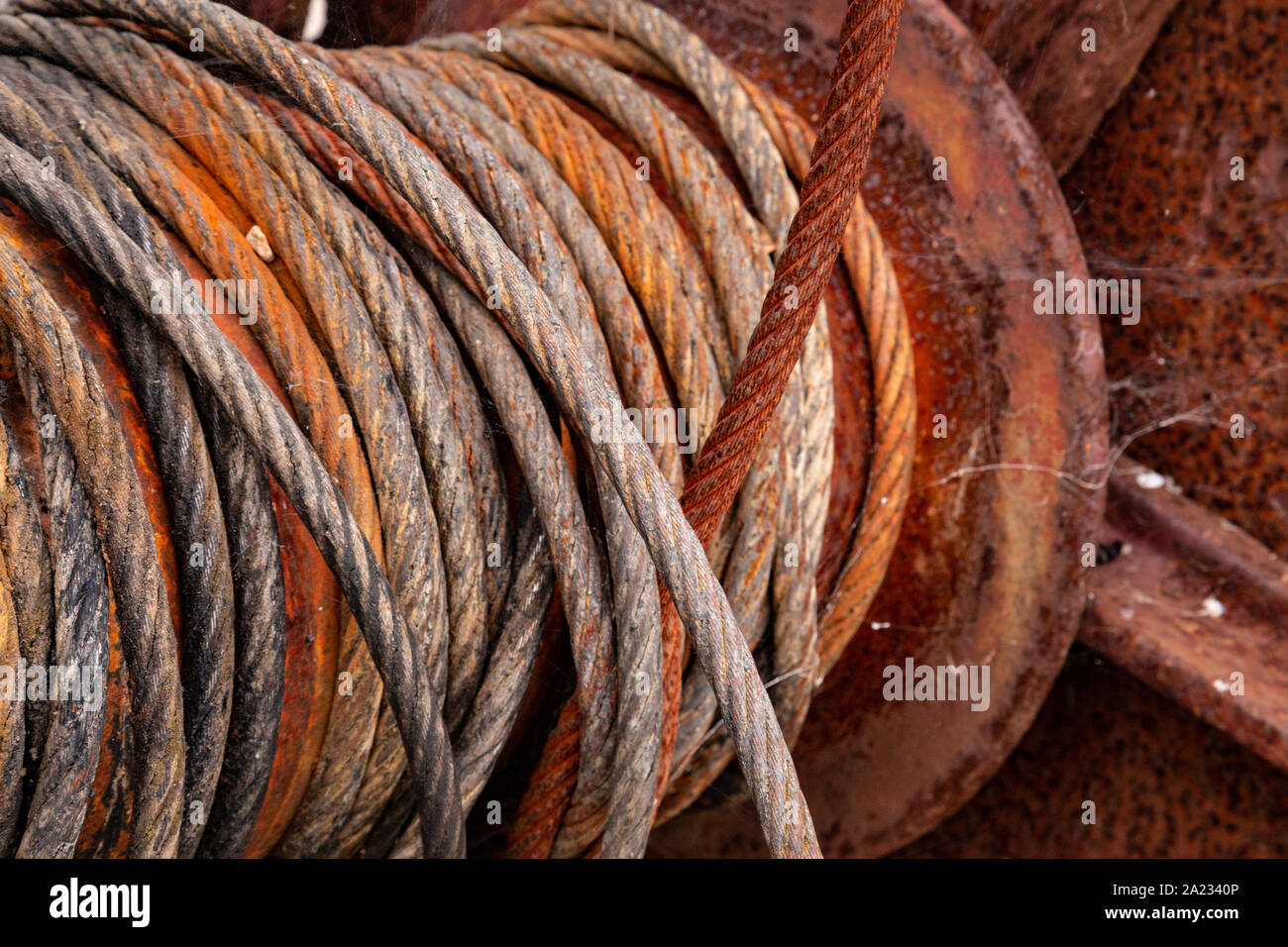 Old rusty cable drum and steel cable at Charlestown, Cornwall Stock ...