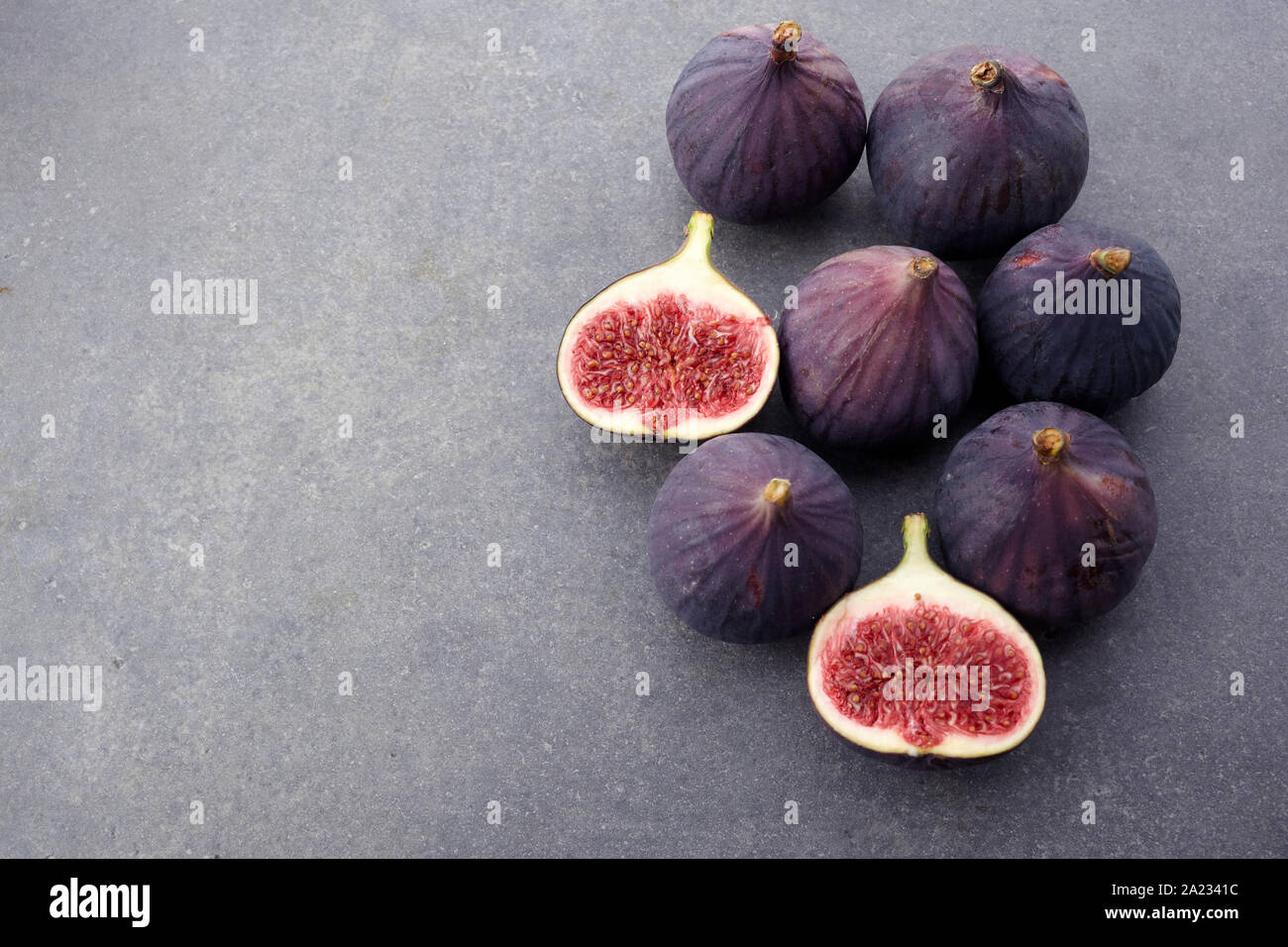 Fresh ripe figs on dark table. Healthy mediterranean fig fruit ...