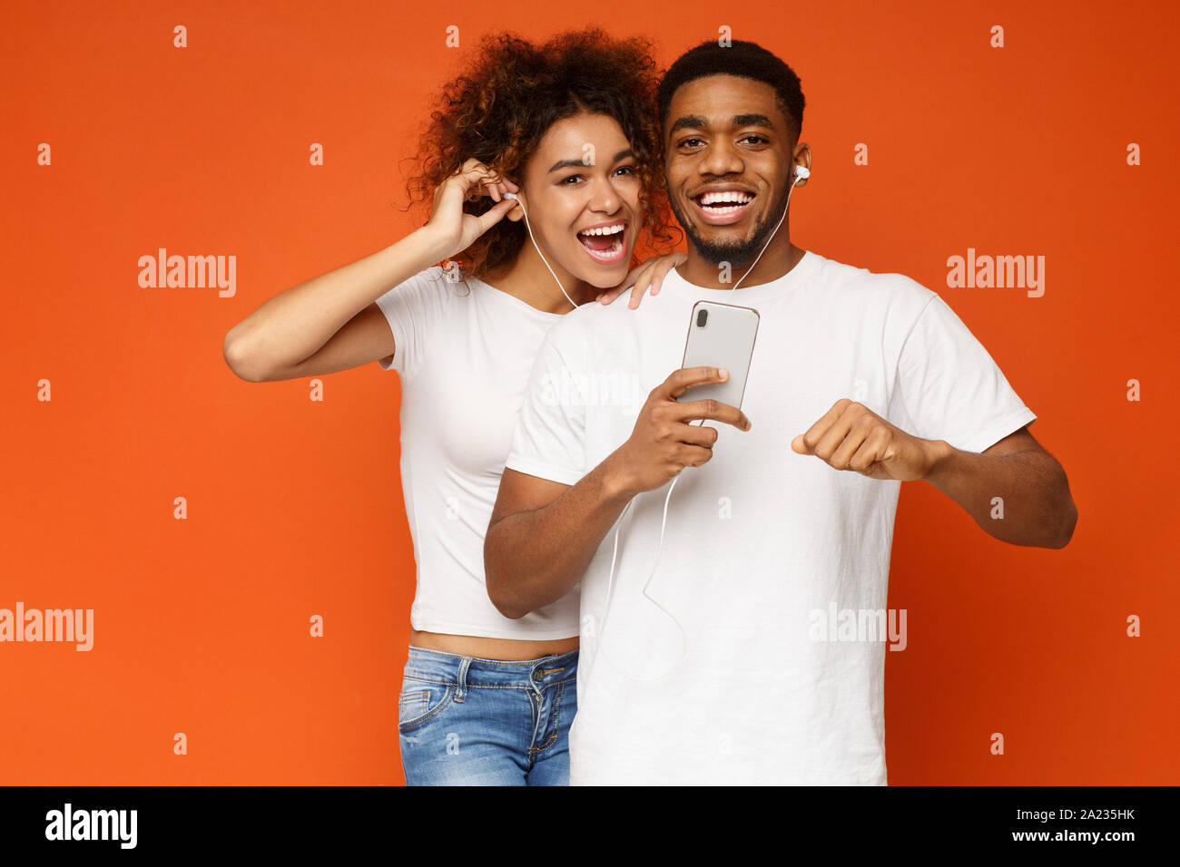 Boy girl sharing headphones hi-res stock photography and images - Alamy