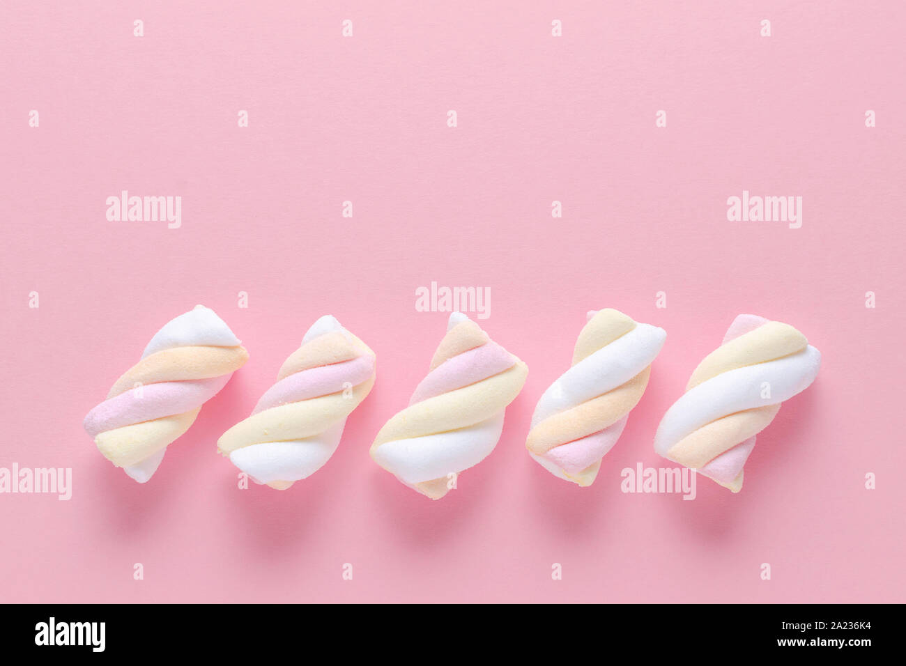 marshmallow in pastel colors on pink background, top view Stock Photo ...