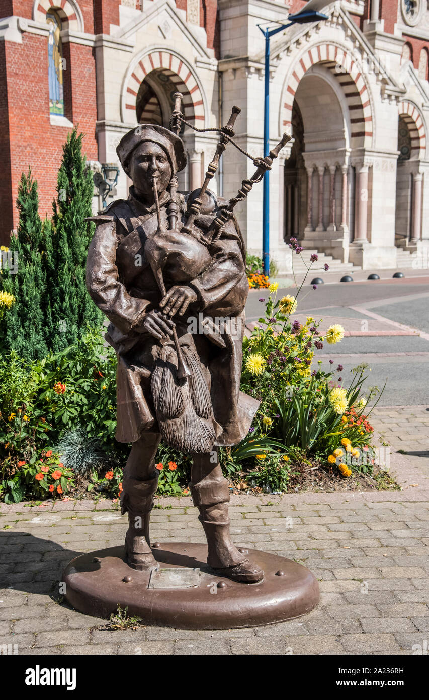 A WWI Scottish Piper plays outside the church of the Basilica Notre ...