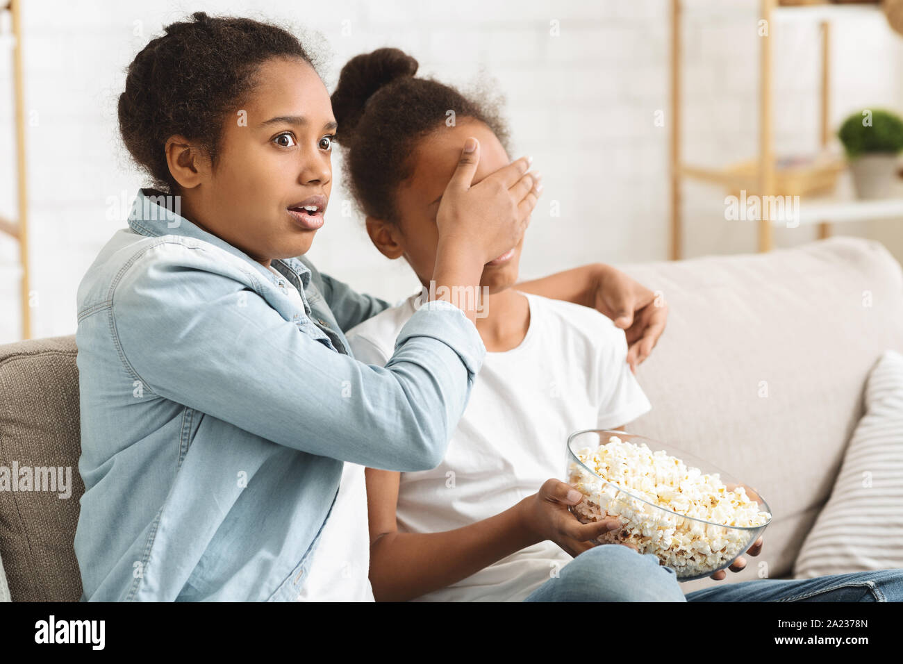 Two kids watching scary movie hi-res stock photography and images - Alamy