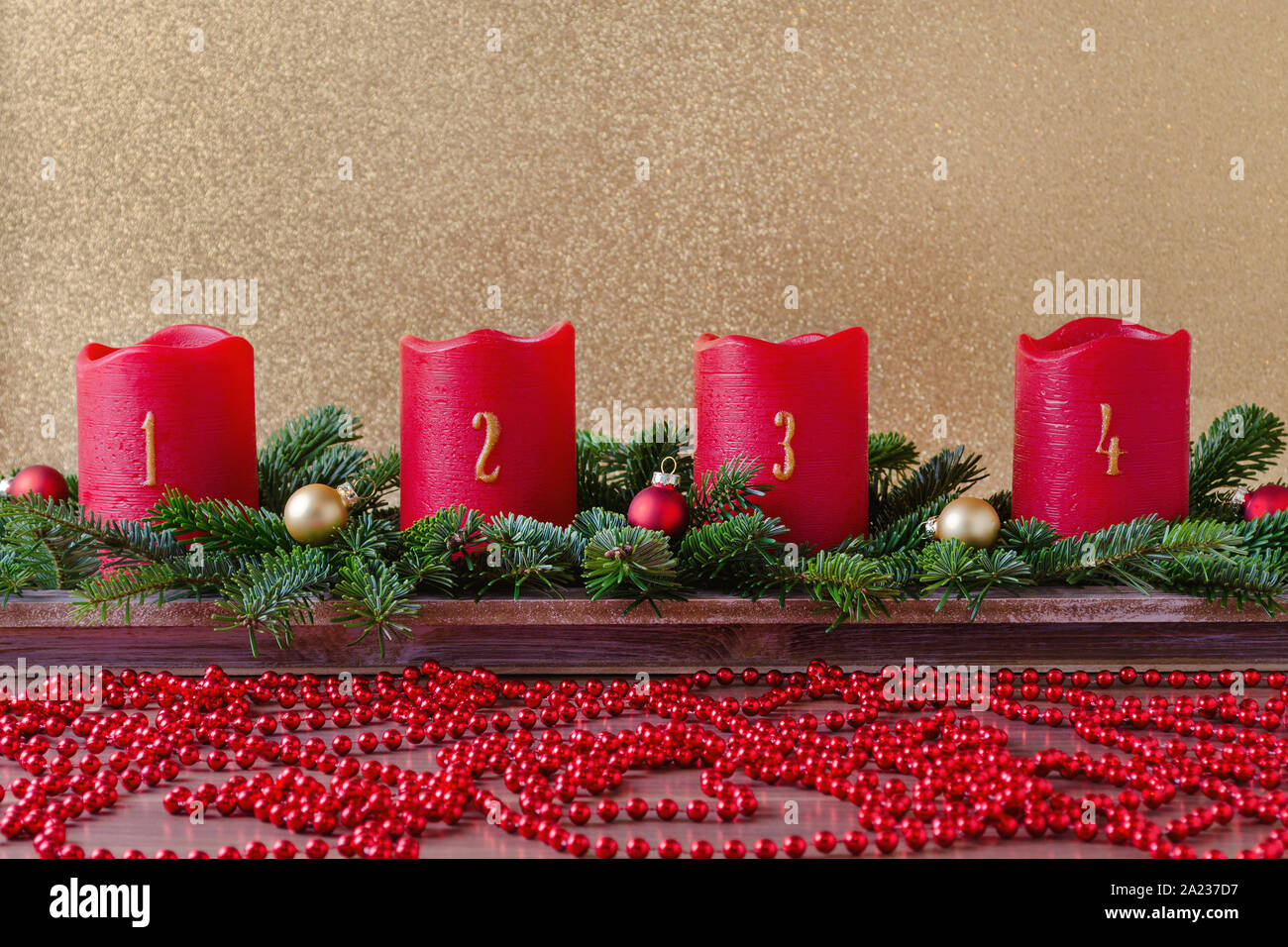 traditional red advent candles with numbers and christmas decoration ...