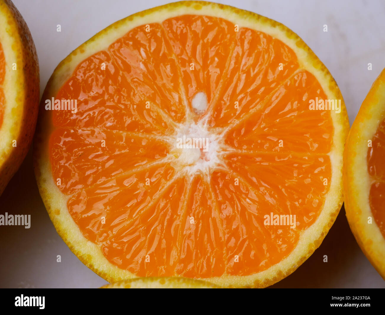 close up of a slice of a ripe orange from above with seeds Stock Photo ...