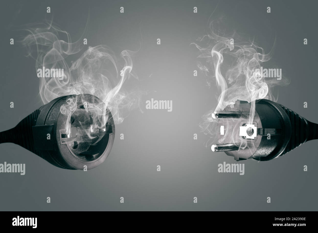 Smoking power plug and socket Stock Photo - Alamy