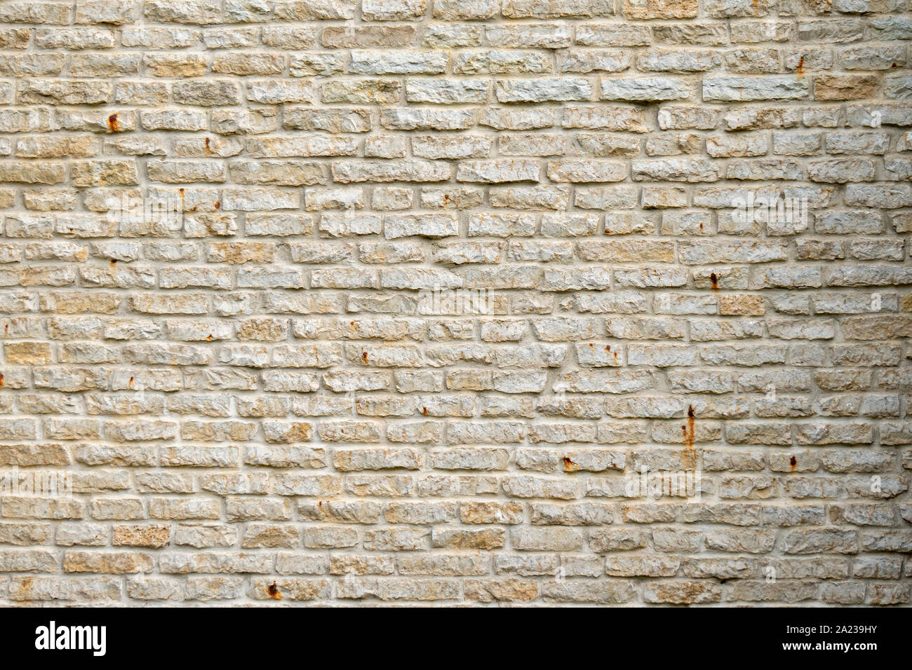 Magnificent old limestone brick wall. Can be used as background or ...