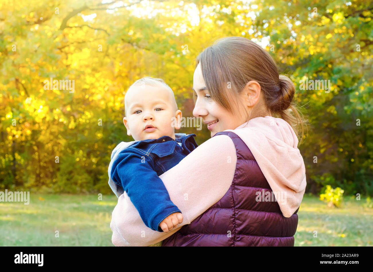 Mother hugging baby outdoors hi-res stock photography and images - Alamy