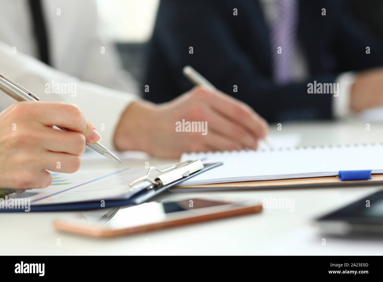 Directors signing important documents Stock Photo - Alamy