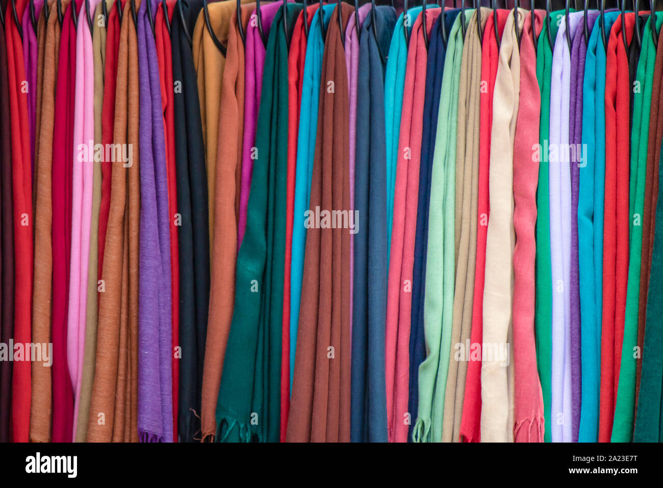 shawl hangers of various colors were filmed in front of the store ...