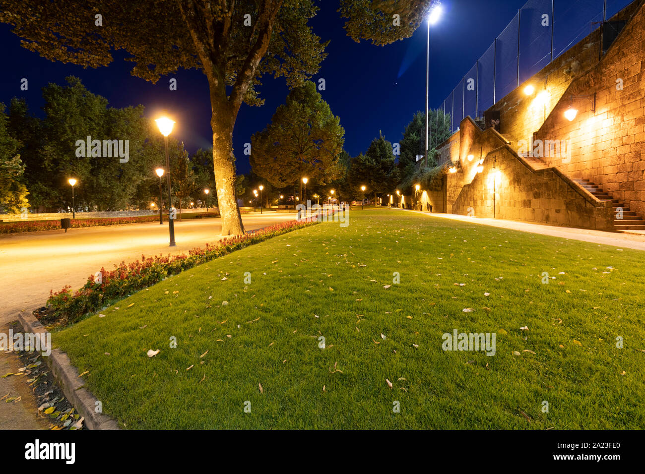 park at night with yellow lights Stock Photo - Alamy