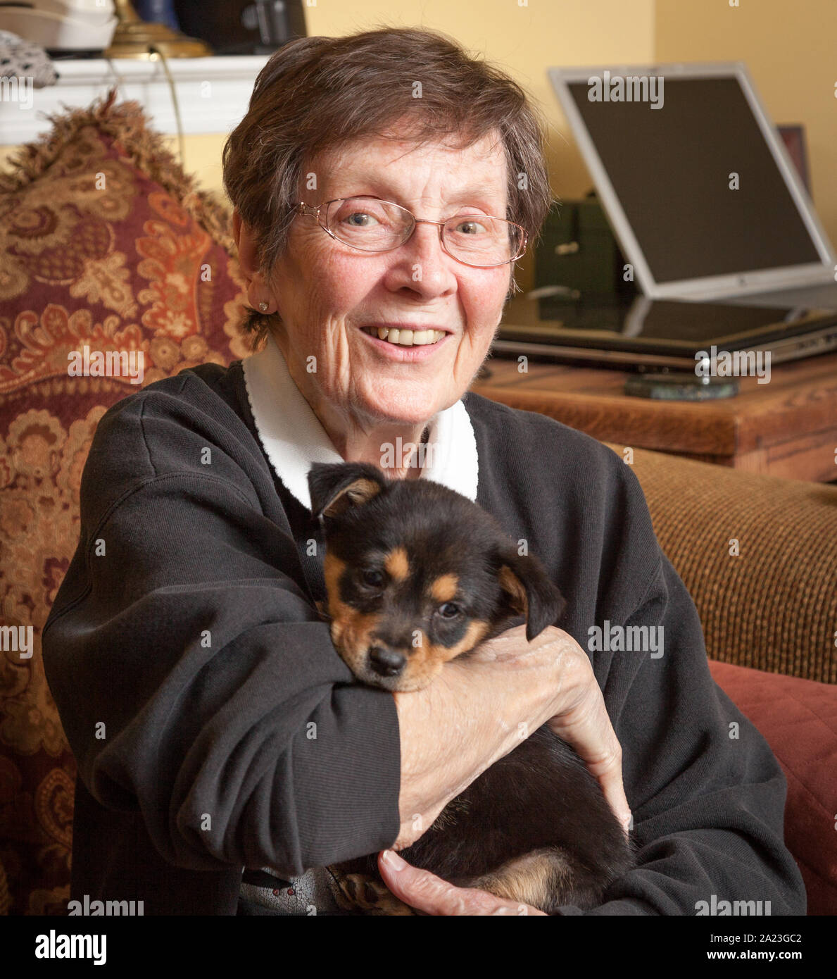 Young adopted rescue puppy acclimating to new "fur-ever" home and ...