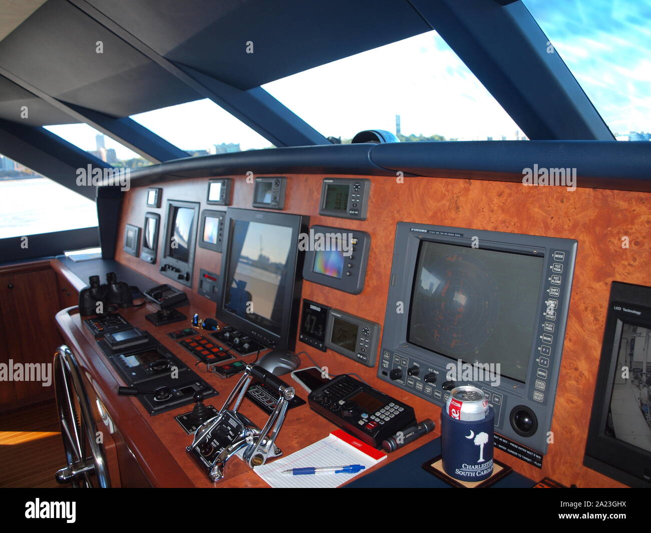 Bridge of expensive yacht with high tech controls and radar screens ...
