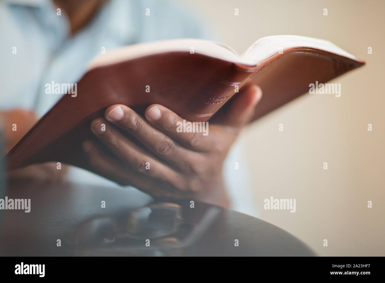 African American man praying and reading the Bible Stock Photo - Alamy