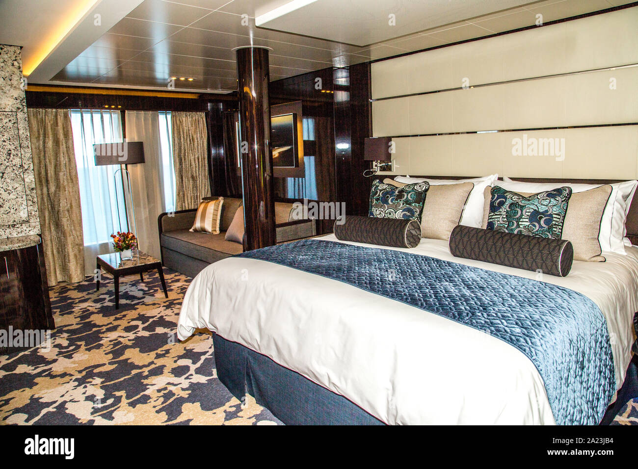 Luxury stateroom in The Haven on the NCL Bliss Stock Photo - Alamy