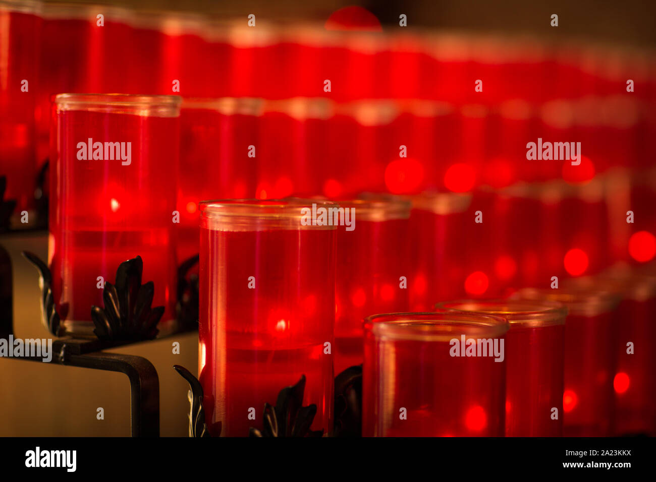 Red candles in a church with copy space Stock Photo - Alamy