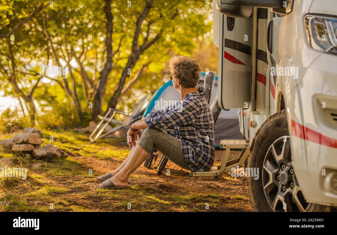 Retired Woman in Her 60s Enjoying Her Vacation with Camper Van. Senior ...