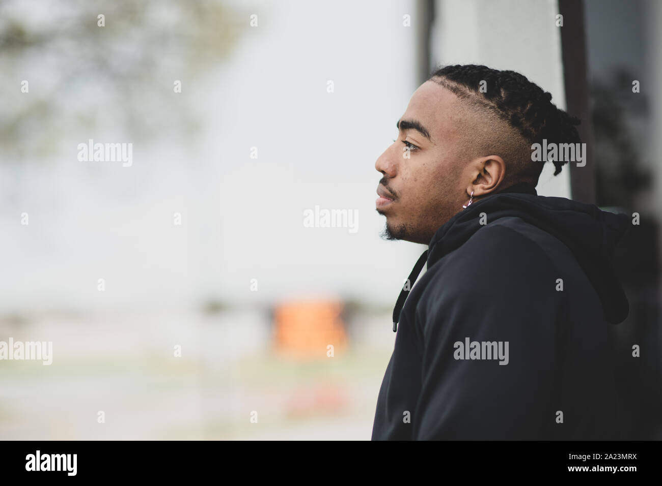 Man wearing hoddie hi-res stock photography and images - Alamy